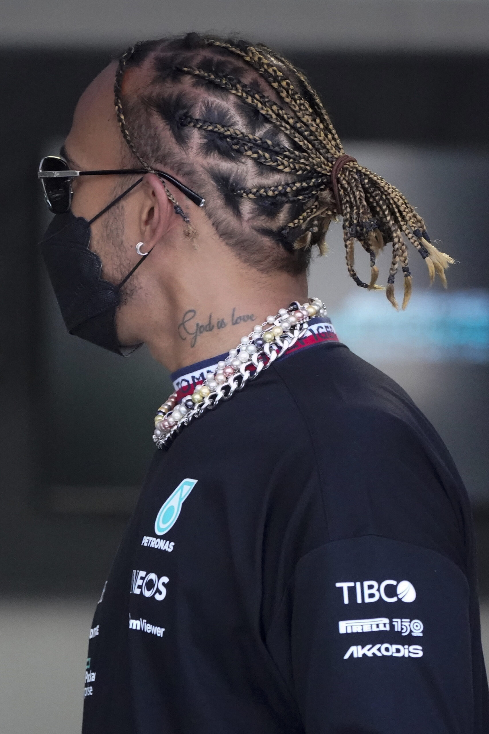 Racer Lewis Hamilton blinged for the gods to protest piercings ...
